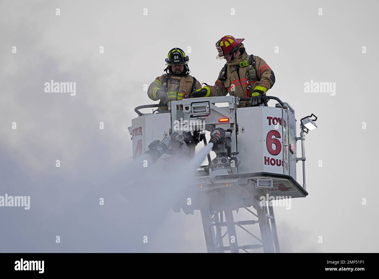 Houston firefighters battle a fire at the Springwood Suites hotel ...