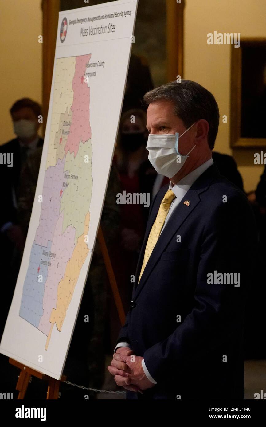 Georgia Gov. Brian Kemp answers questions during a news conference to ...