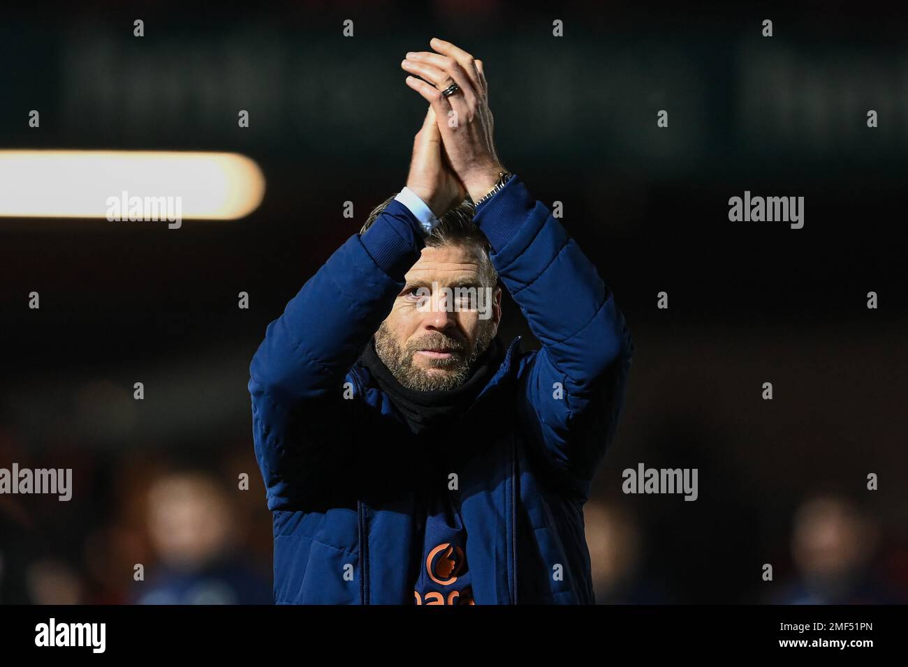 Luke Garrard manager of Boreham Wood applauds the fans at the end of ...