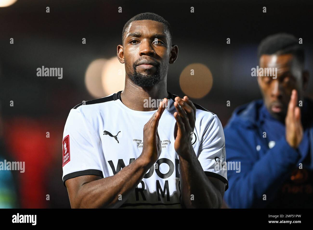 Lee Ndlovu #9 of Boreham Wood applauds the fans at the end of the ...