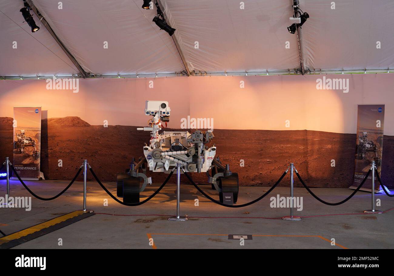 A full-scale model of the Mars 2020 Perseverance rover is seen behind ...