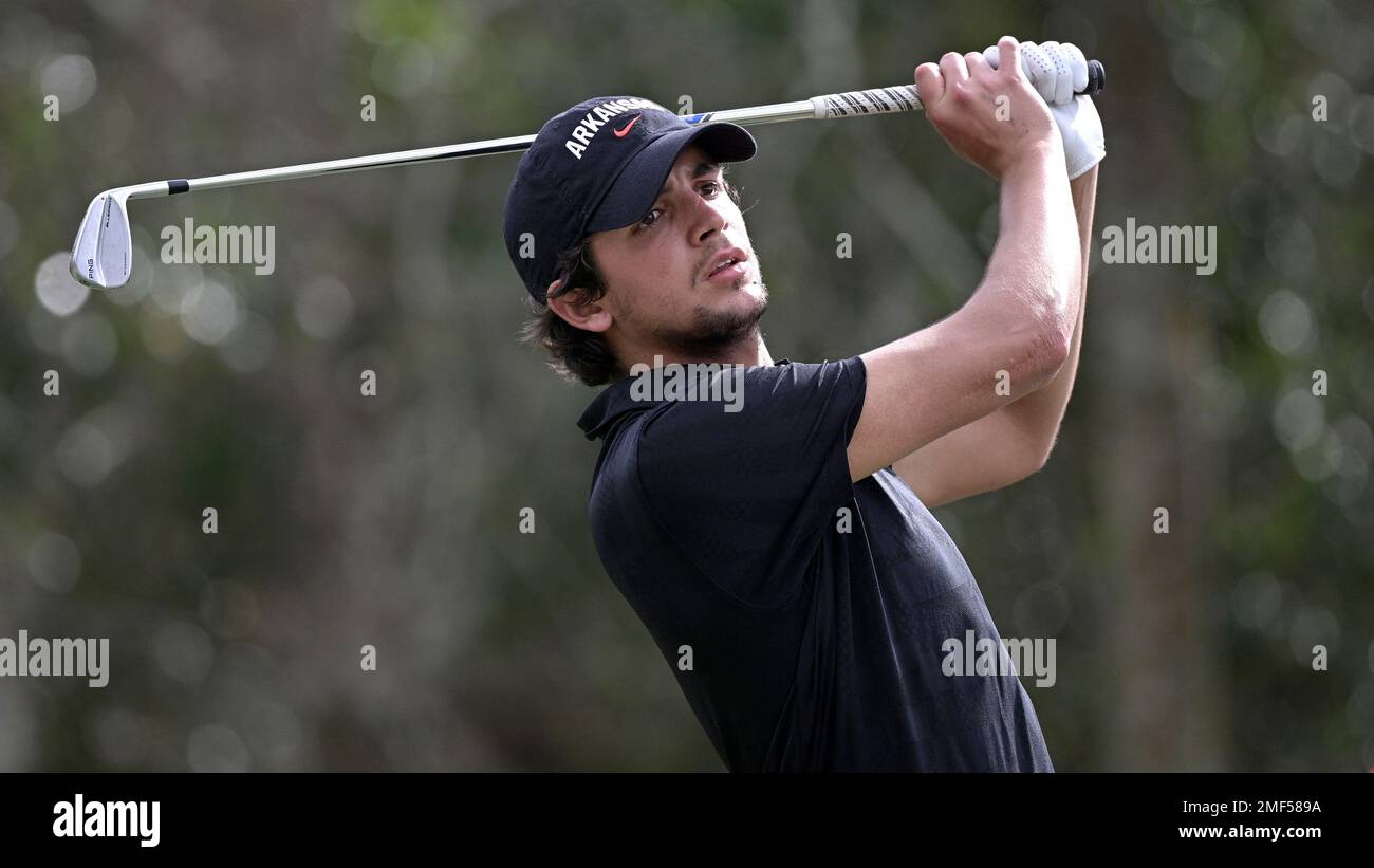 Segundo Pinto, of Arkansas, watches his tee shot on the eighth hole ...