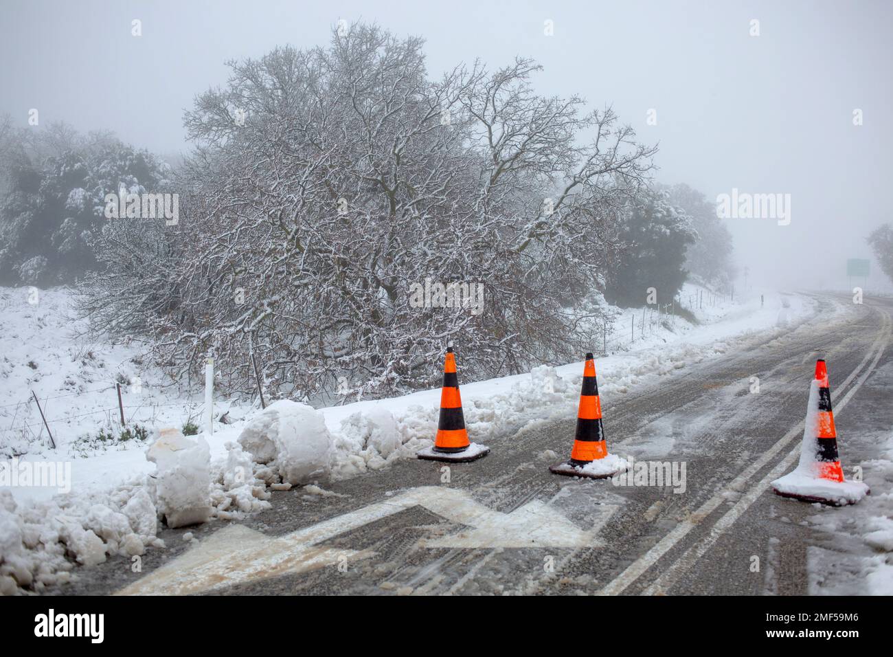 A road with snow is blocked near the Quneitra border crossing between ...