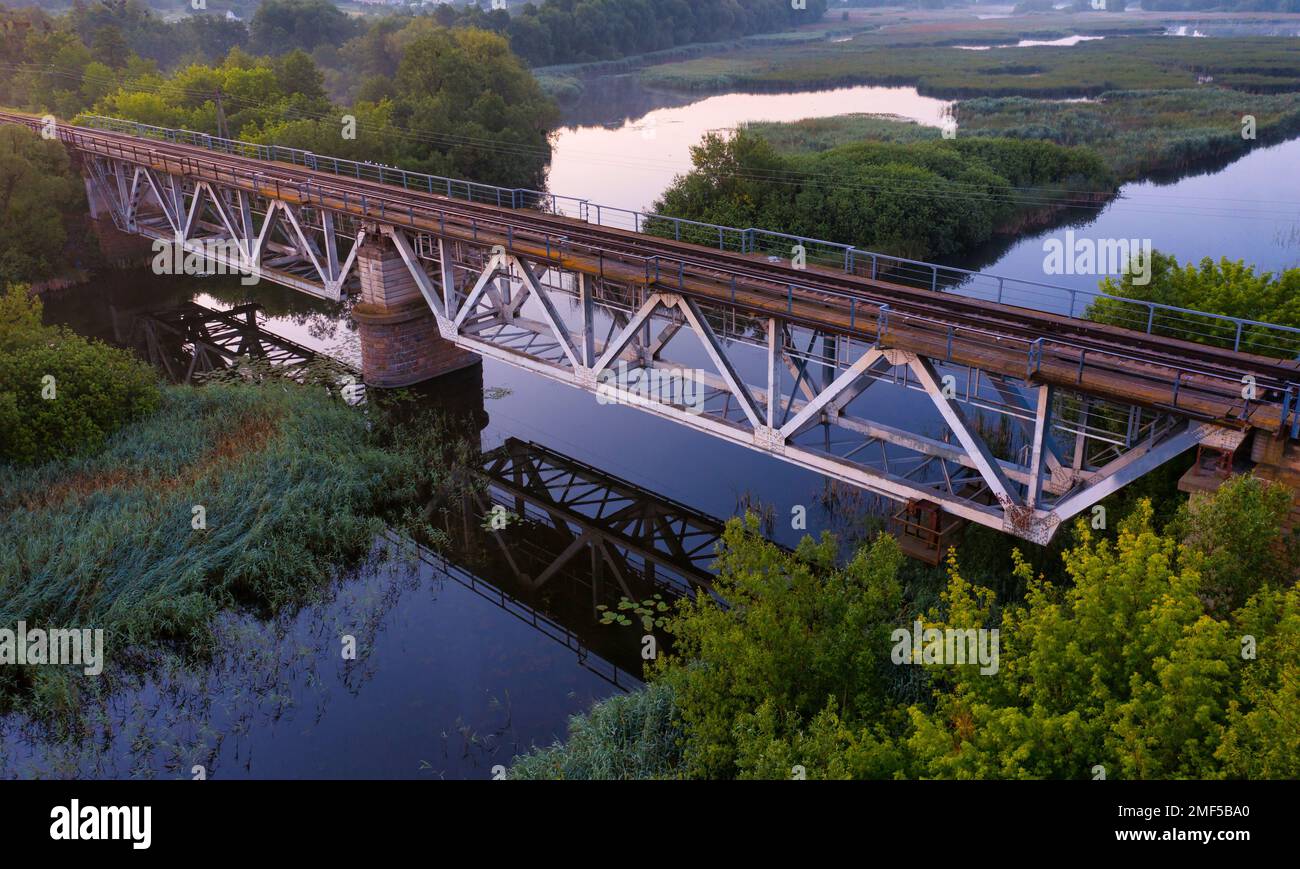 Metal double railway bridge. Freight and passenger transportation by ...
