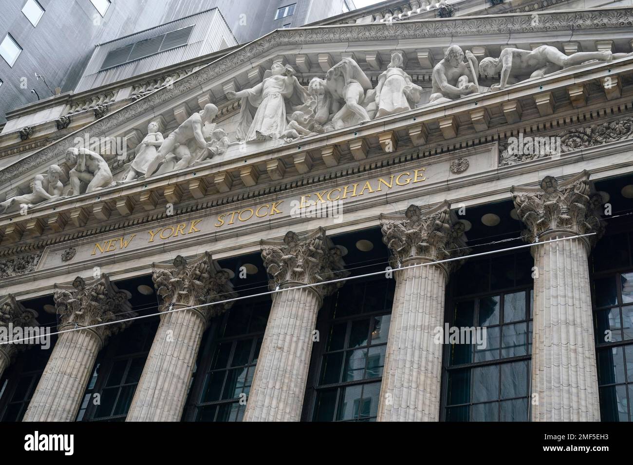 Pedestrians pass the New York Stock Exchange Tuesday, Feb. 16, 2021, in ...