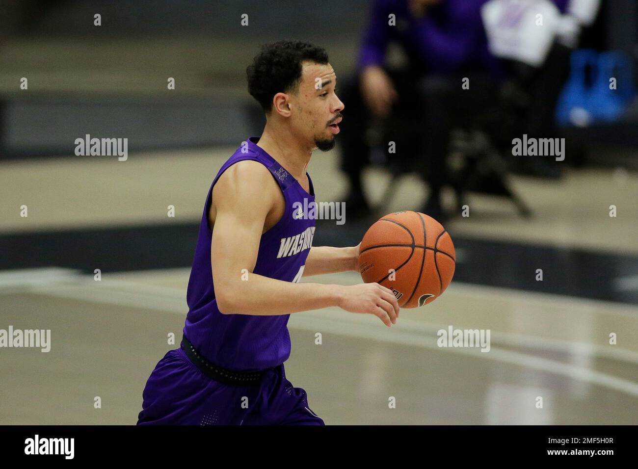 Washington guard Nate Pryor brings the ball up the court during the ...