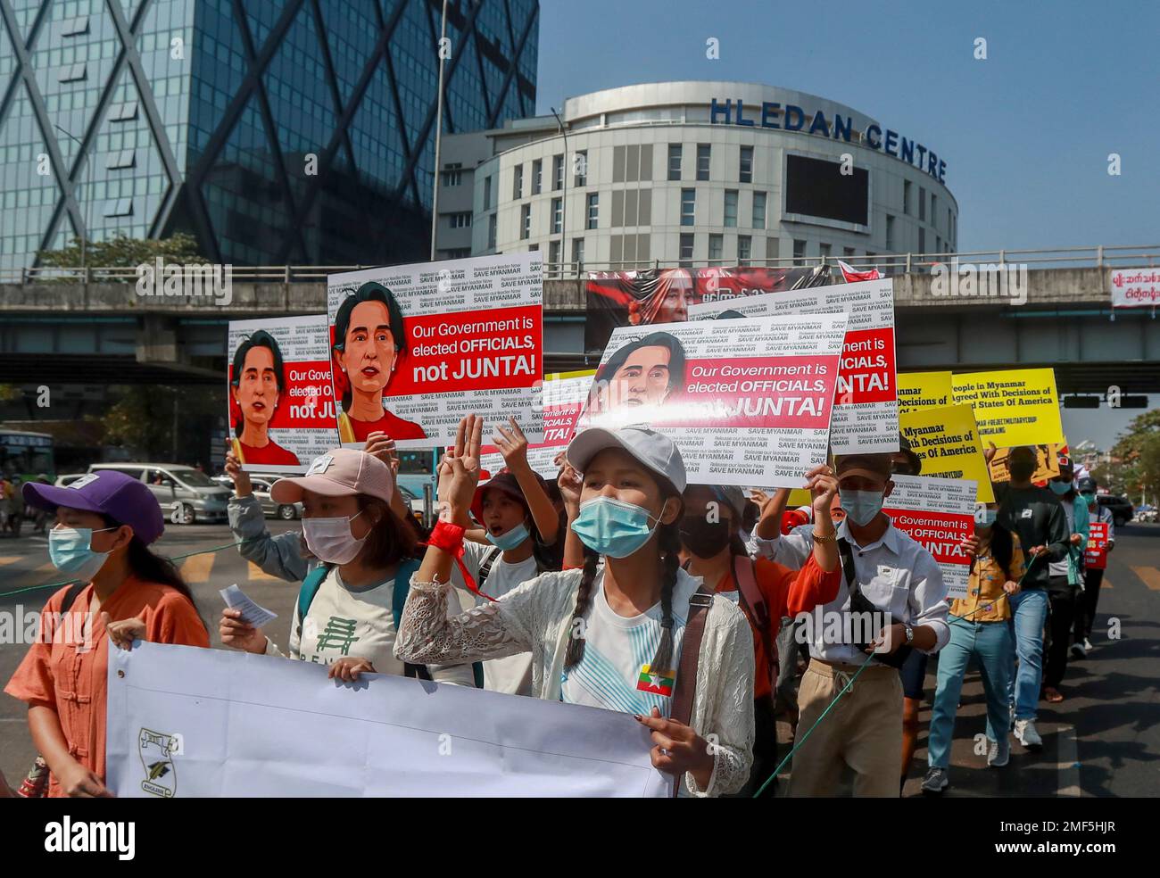 Demonstrators display pictures of detained Myanmar leader Aung San Suu ...