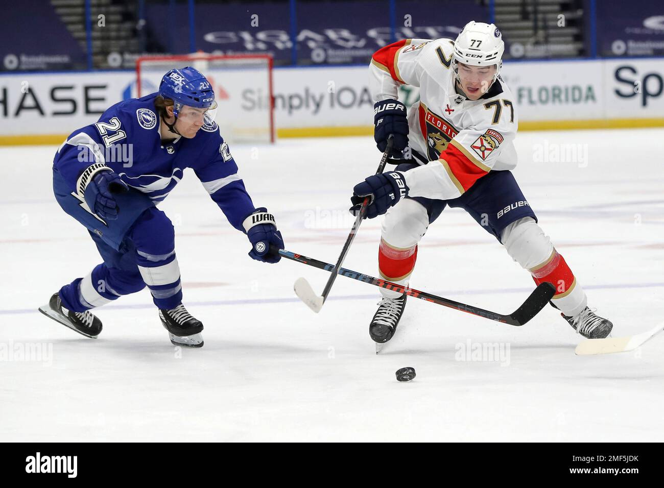 Tampa Bay Lightning's Brayden Point, left, defends against Florida ...