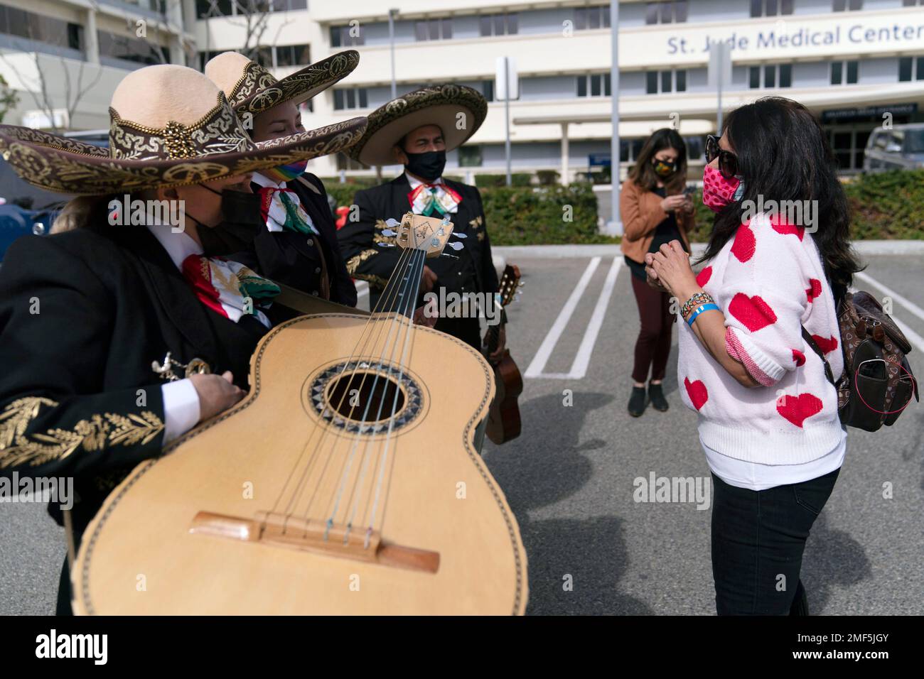 Patty Trejo, 54, right, talks to mariachi band members, Sally Hawkridge ...