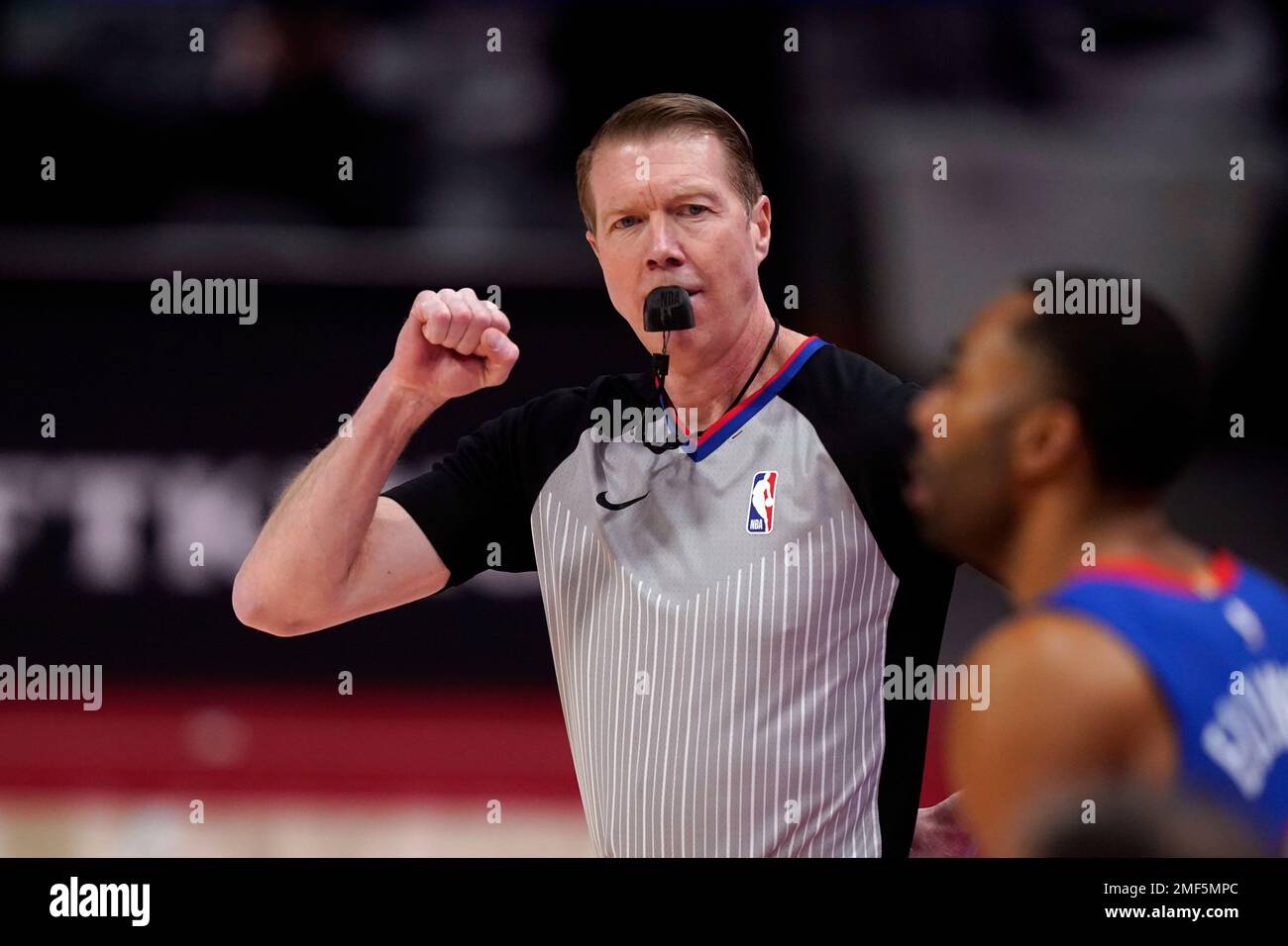 Referee Ed Malloy signals during the second half of an NBA basketball ...