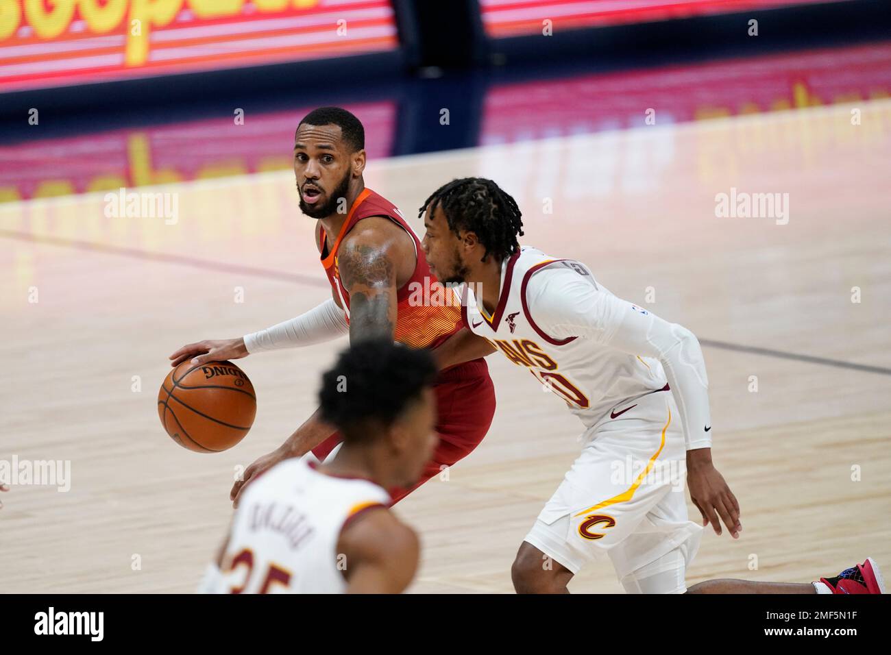 Denver Nuggets guard Monte Morris (11) and Cleveland Cavaliers guard ...