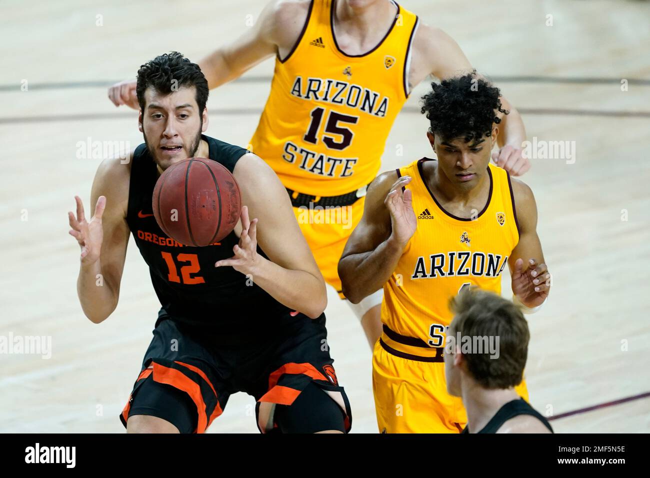 Oregon State center Roman Silva (12) is fouled by Arizona State guard ...