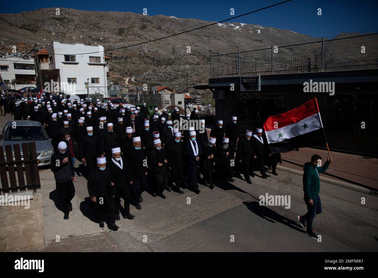 Druse supporters of Syrian President Bashar Assad wave Syrian flags ...
