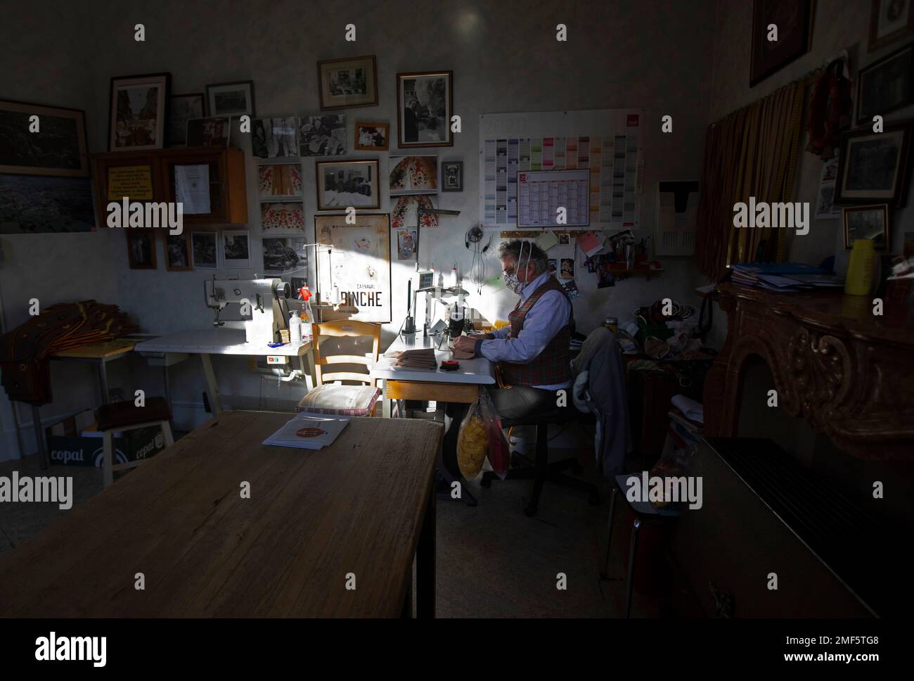 Tailor Karl Kersten sews pieces of Gilles de Binche costumes at his ...