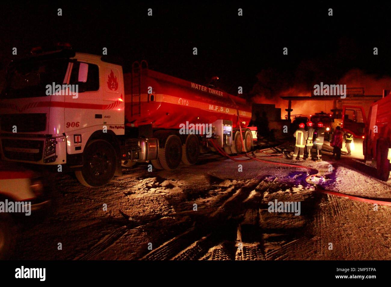 Iranian firefighters work on a burning tanker carrying fuel at the ...