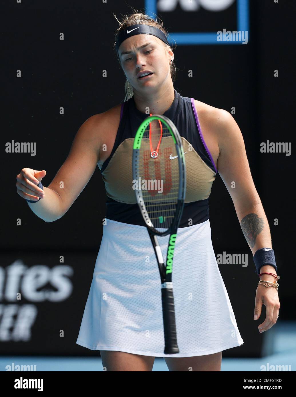 Aryna Sabalenka of Belarus drops her racket in frustration during her ...