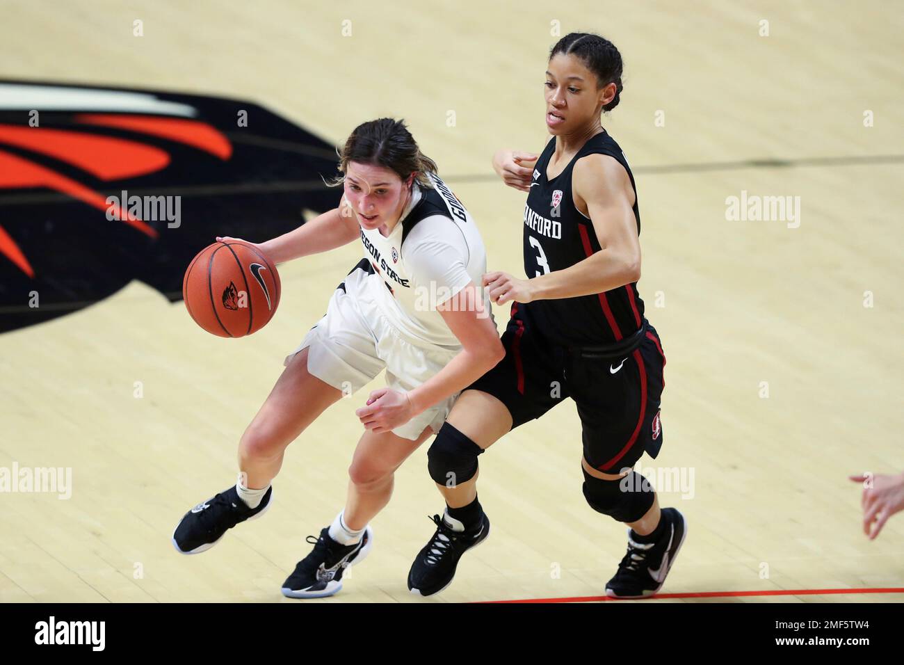Oregon State's Aleah Goodman drives next to Stanford's Anna Wilson ...