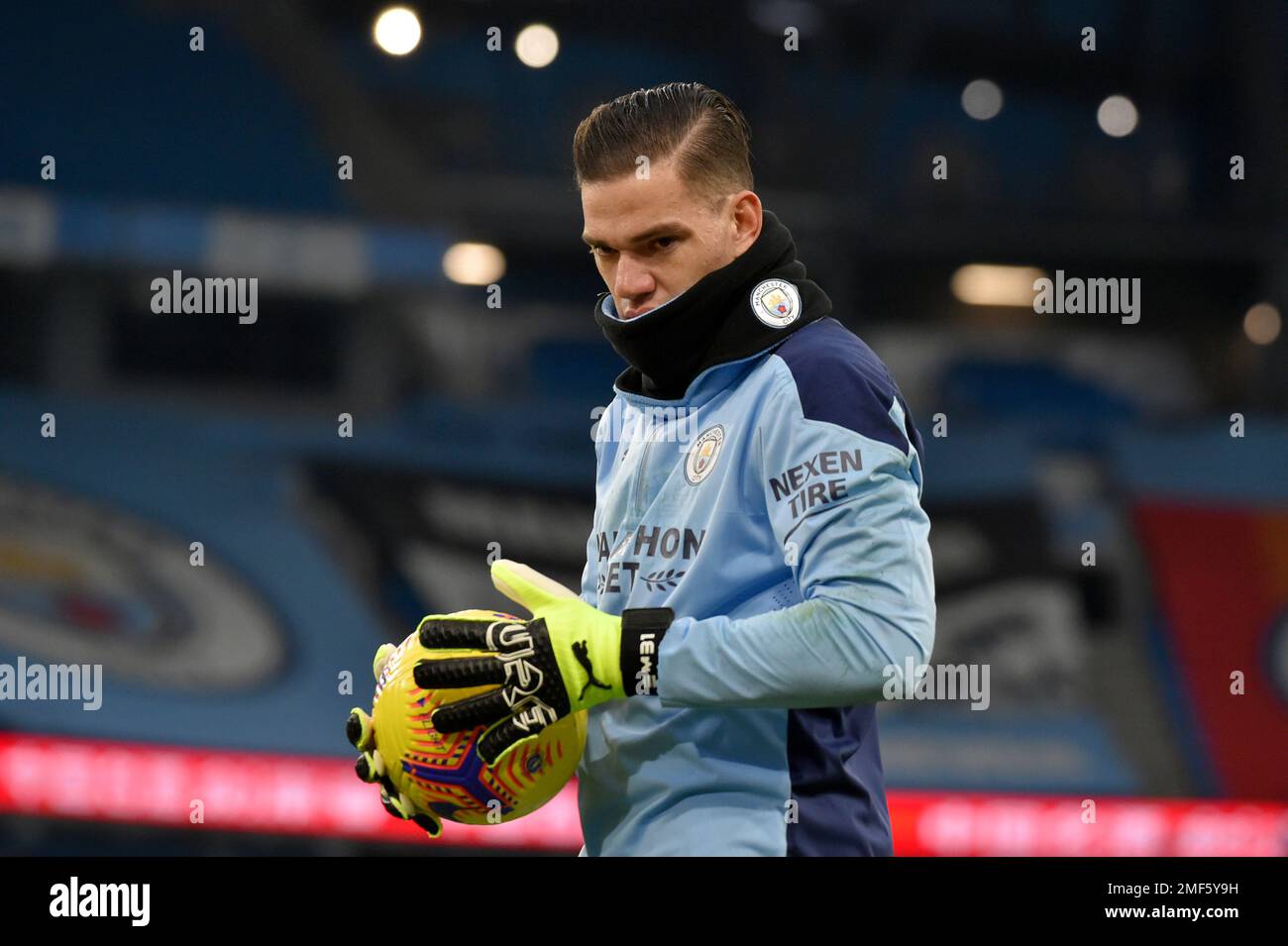 Manchester City's goalkeeper Ederson holds a ball during warmup before ...