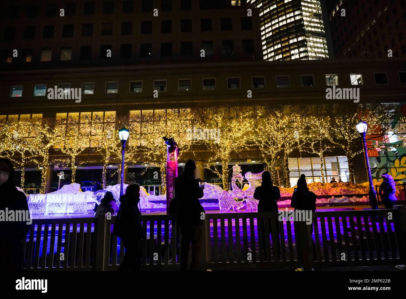 People pass Lunar New Year ice sculptures at Brookfield Place Friday ...