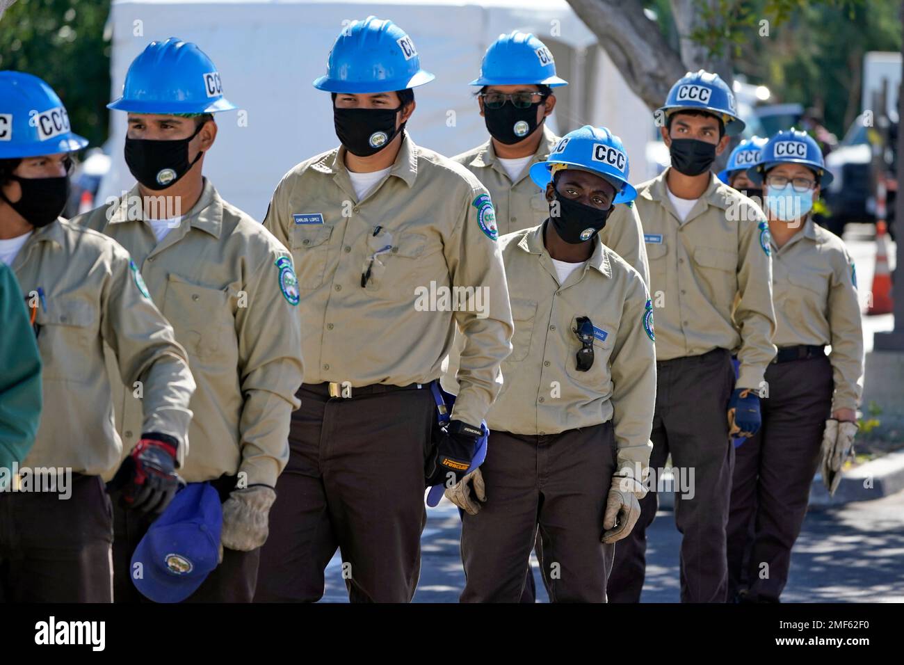 Members of the California Conservation Corps line up to help with the ...