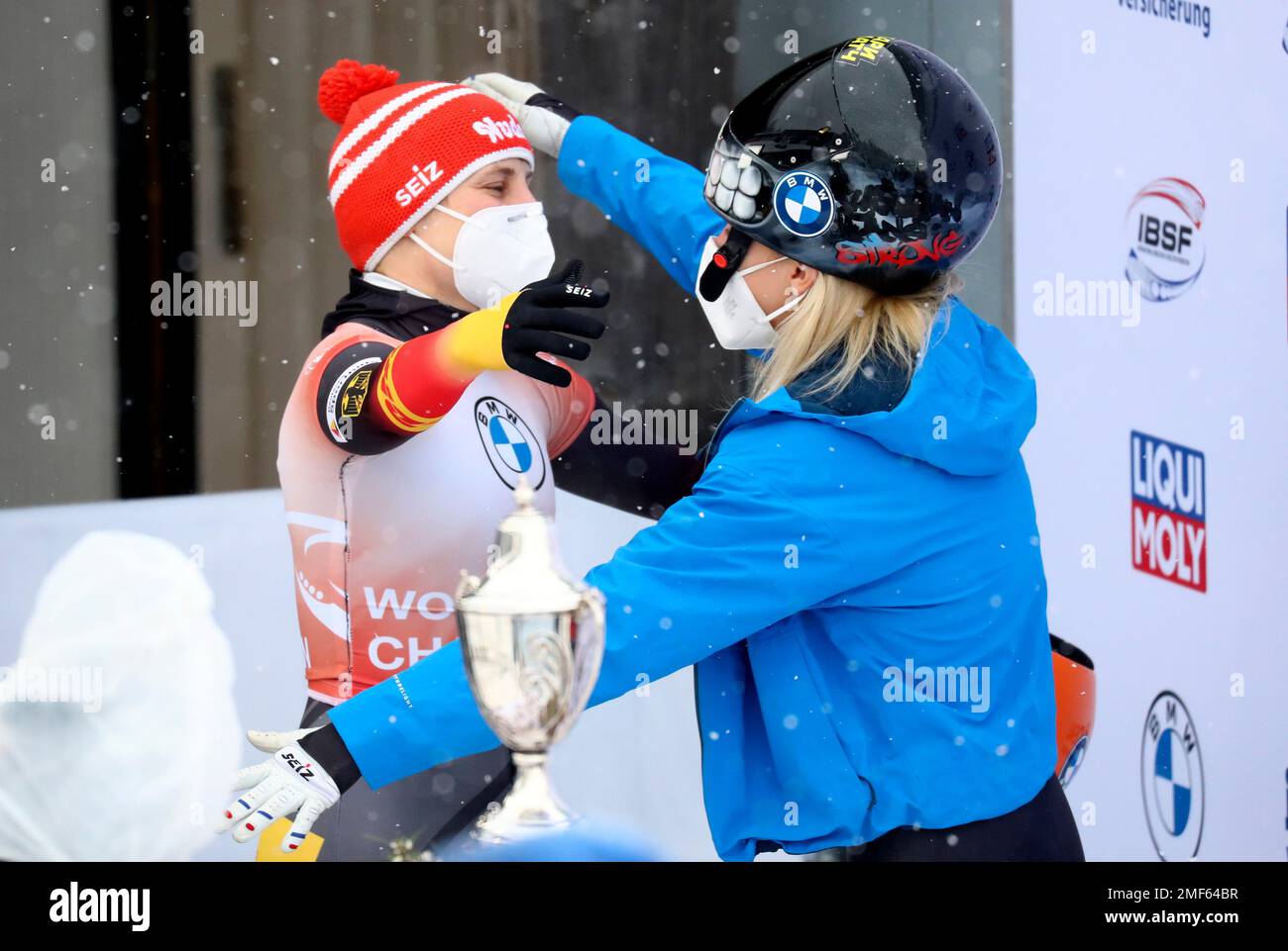 First place, Germany's Tina Hermann, left, embraces third place, Russia ...