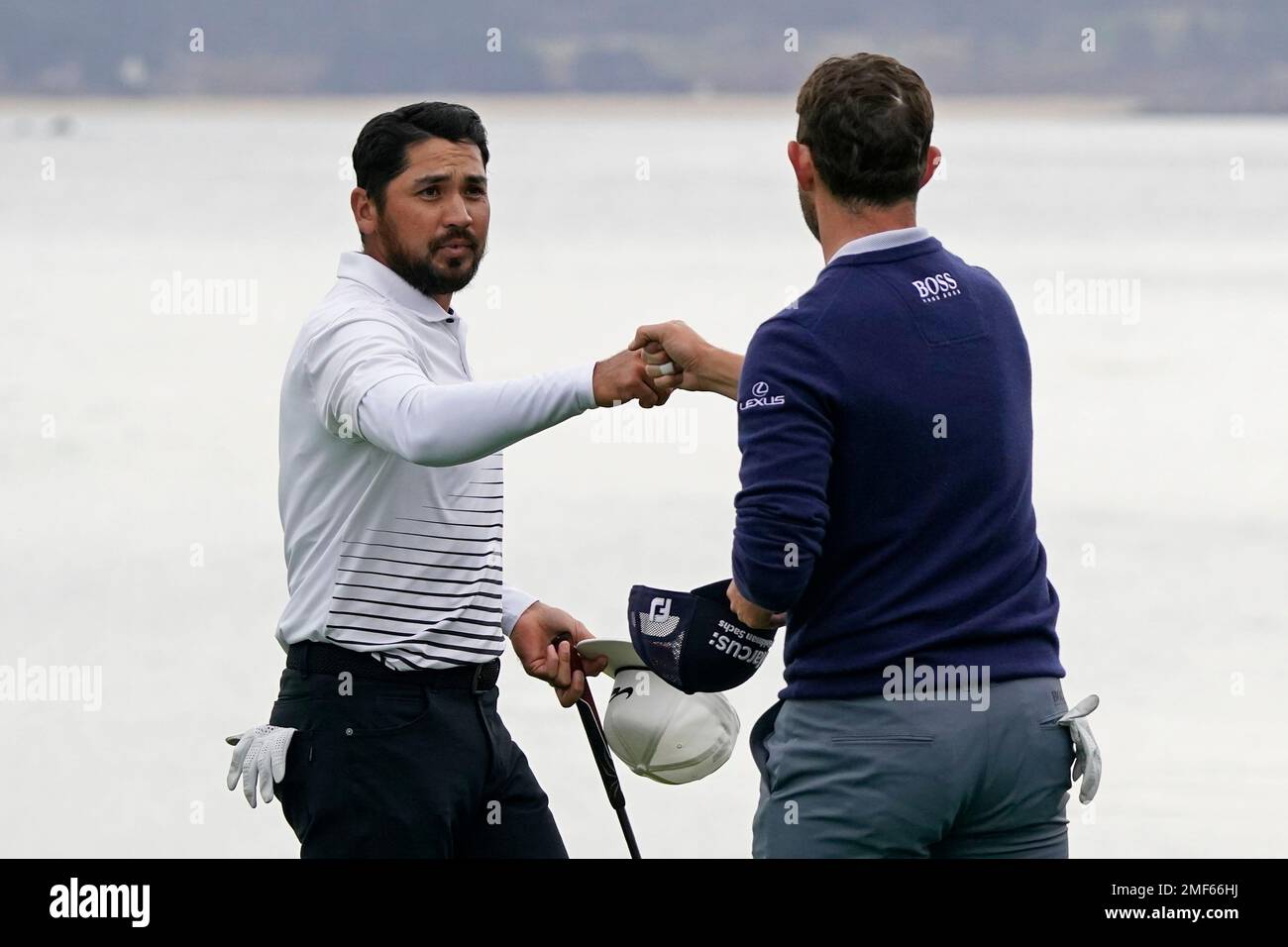 Jason Day, left, of Australia, greets Patrick Cantlay, right, on the ...