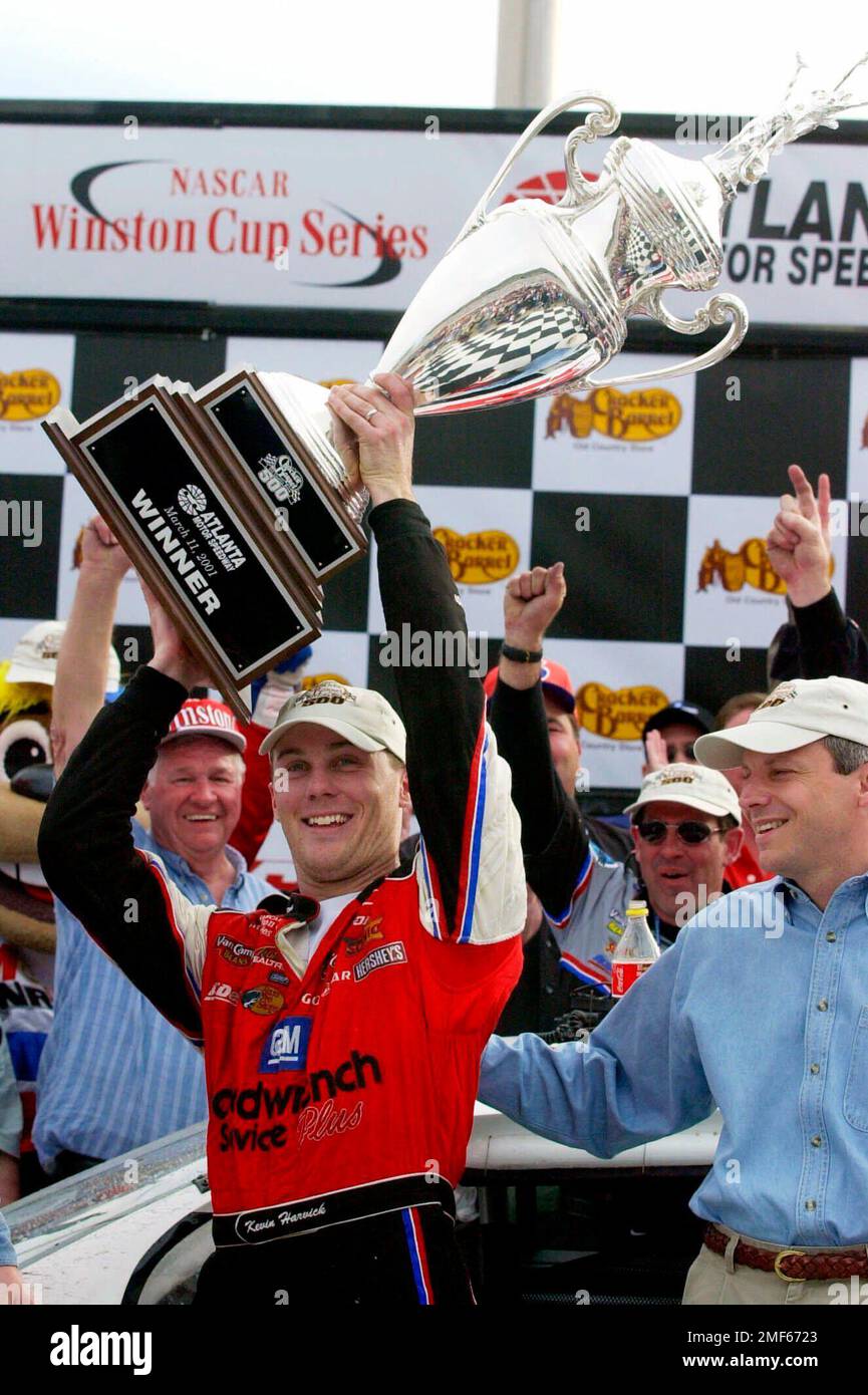 FILE - In this March 11, 2001, file photo, Kevin Harvick holds up the ...