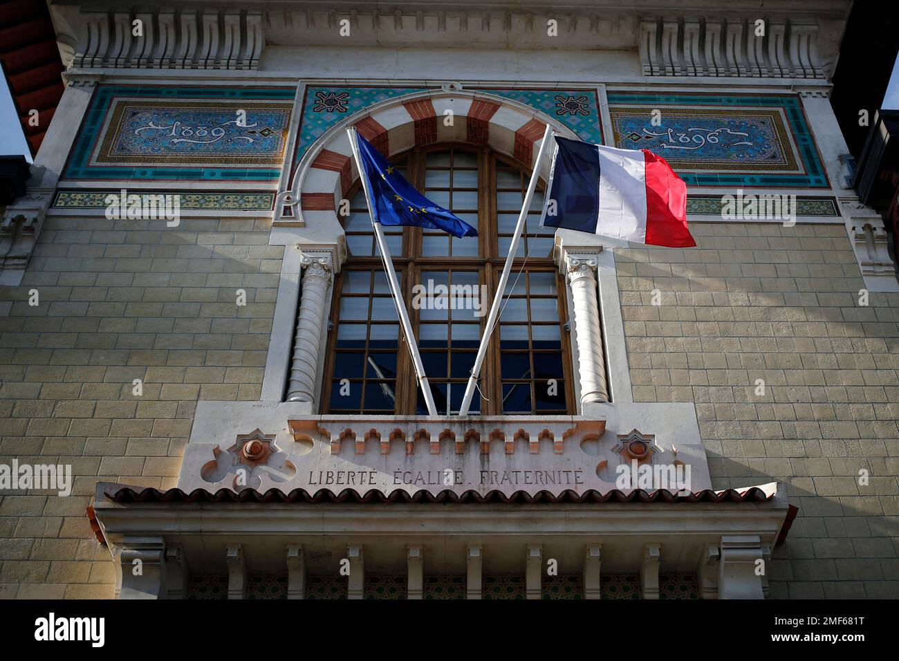 European and Fench flags at the entrance of the French National School ...