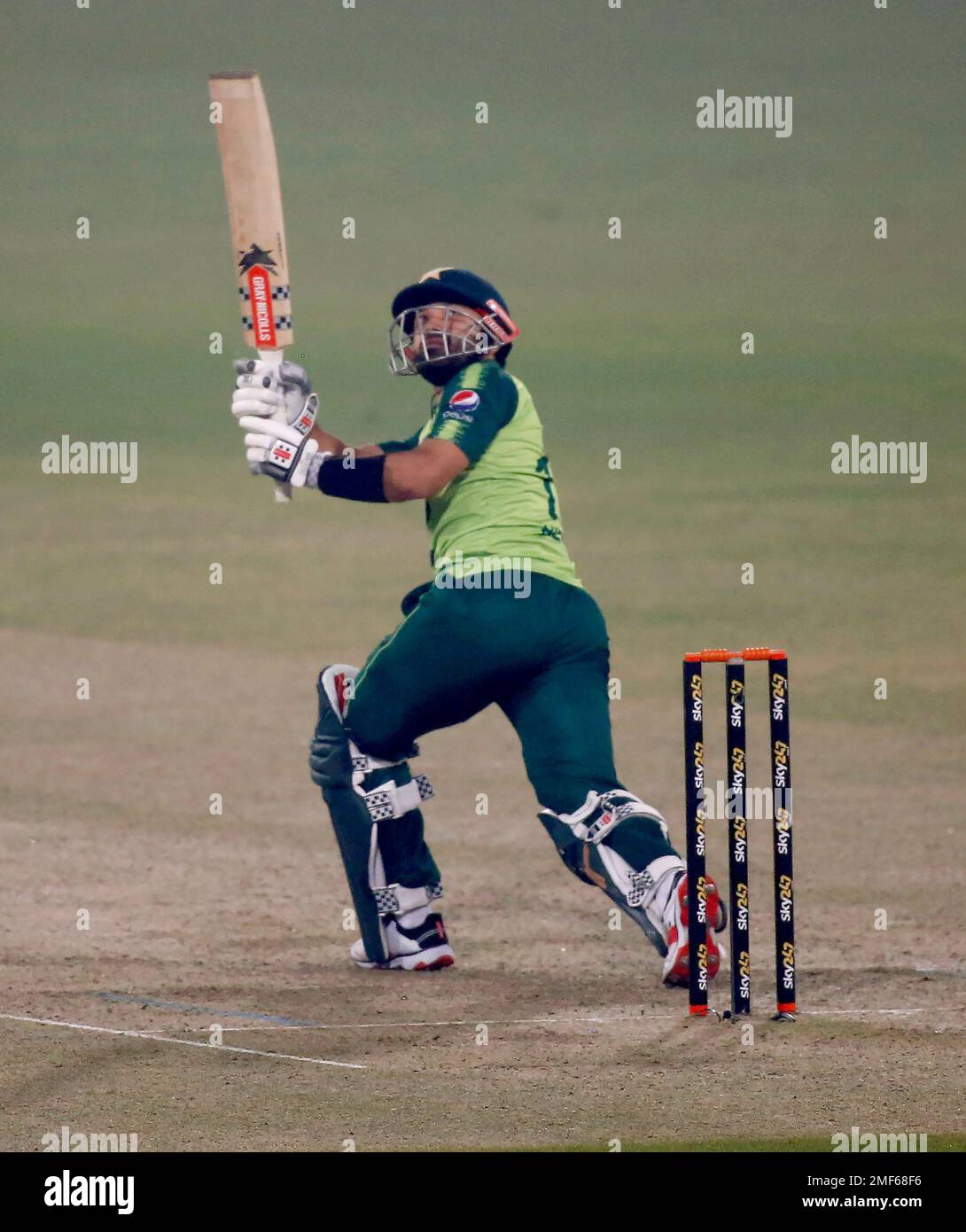 Pakistan's Mohammad Rizwan follow the ball after playing a shot for six ...