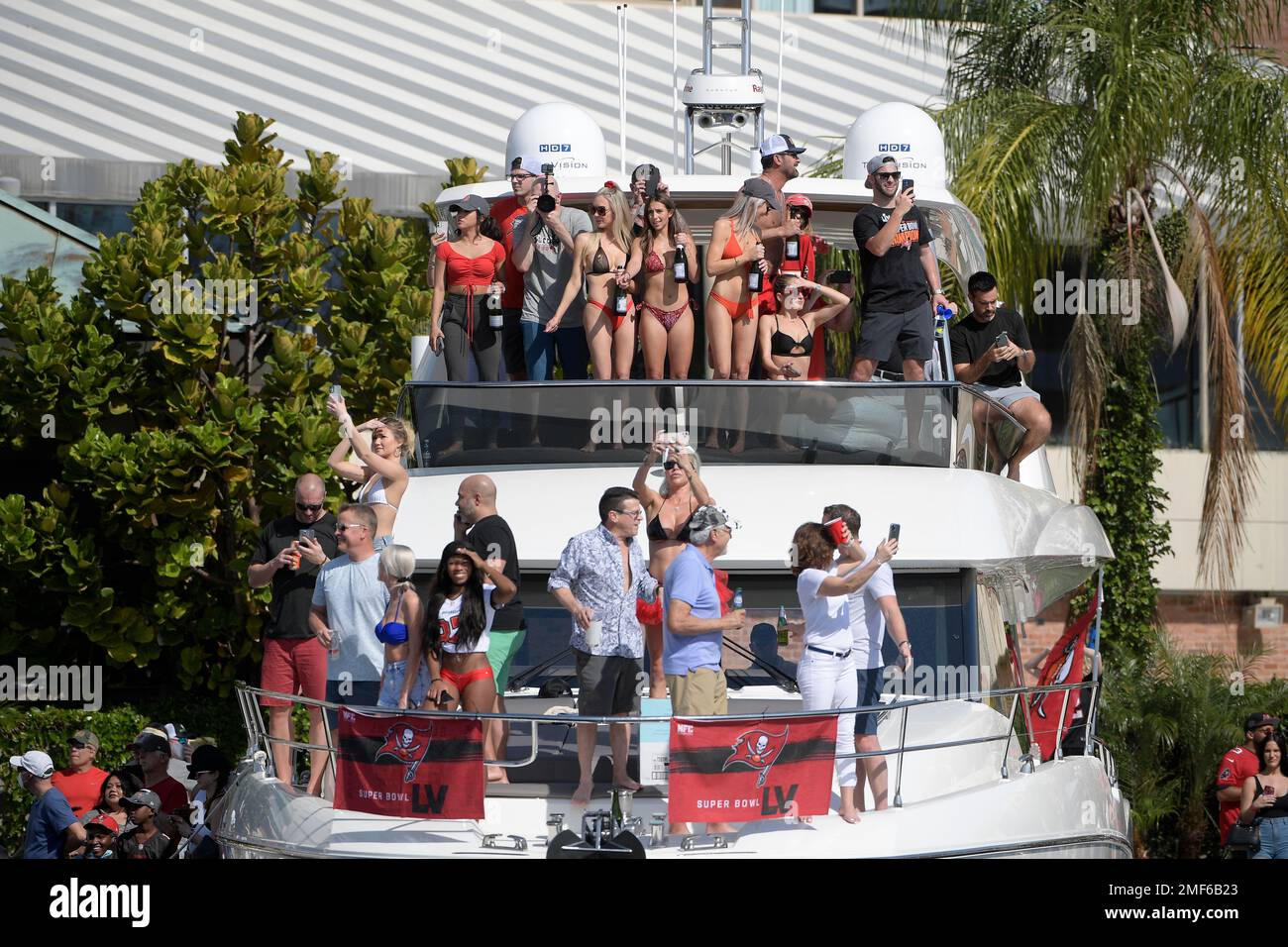 Fans watch as members of the Tampa Bay Buccaneers team and family ...