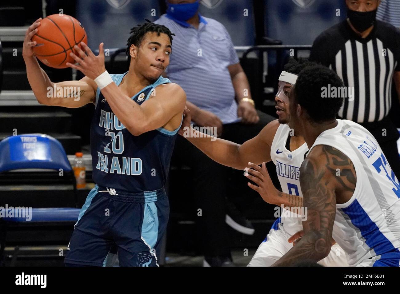 Rhode Island's Ishmael Leggett, left, passes as Saint Louis' Jordan ...