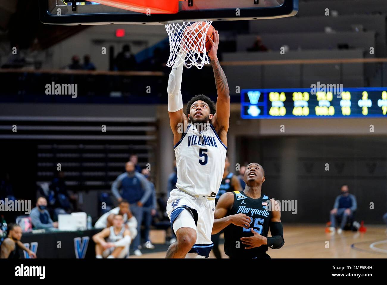 Villanova's Justin Moore (5) goes up for a dunk past Marquette's Koby ...