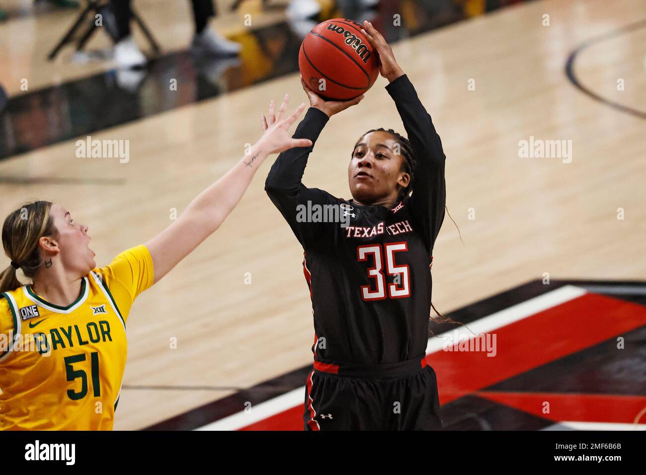 Texas Tech's Alexis Tucker (35) shoots as Baylor's Caitlin Bickle (51 ...