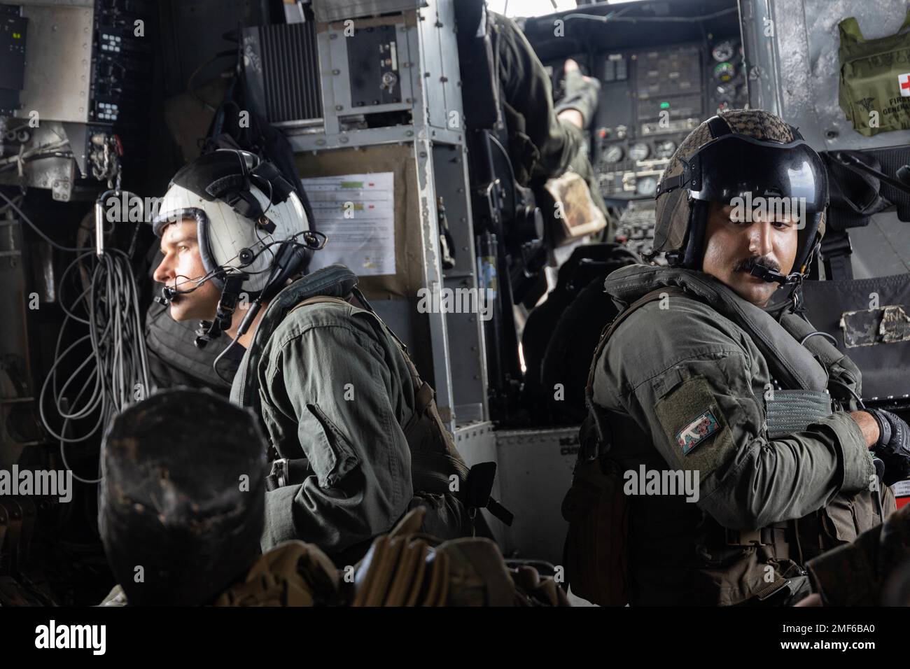 U.S. Marine Corps Cpl. Bryce Lambert, a CH-53E aerial observer, and Cpl ...