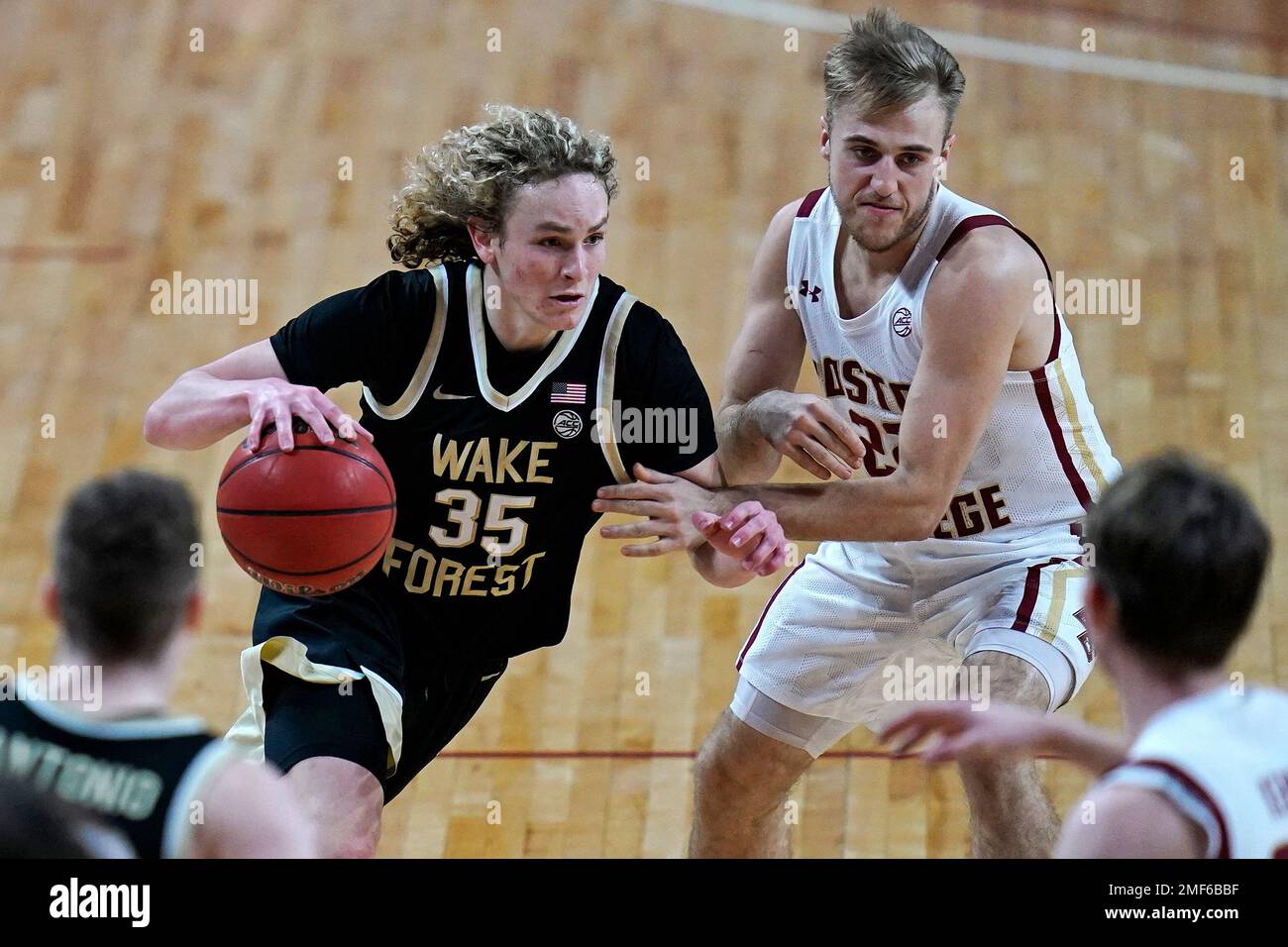 Wake Forest guard Carter Whitt (35) drives to the basket past Boston ...