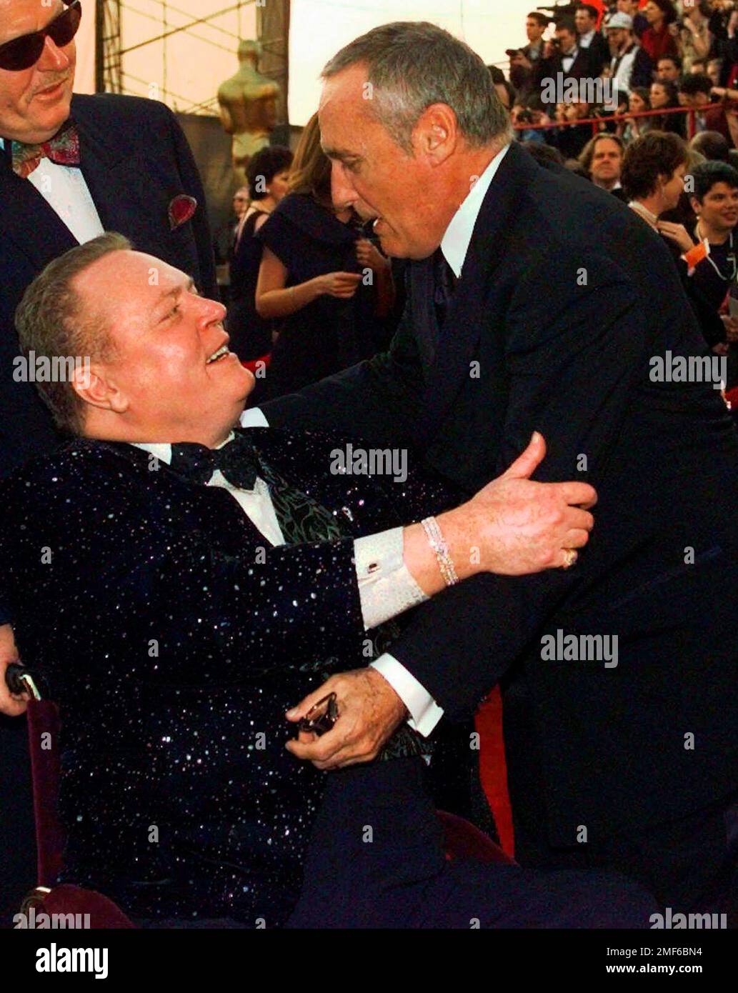 FILE - Dennis Hopper, right, gives Larry Flynt a hug as they arrive for ...
