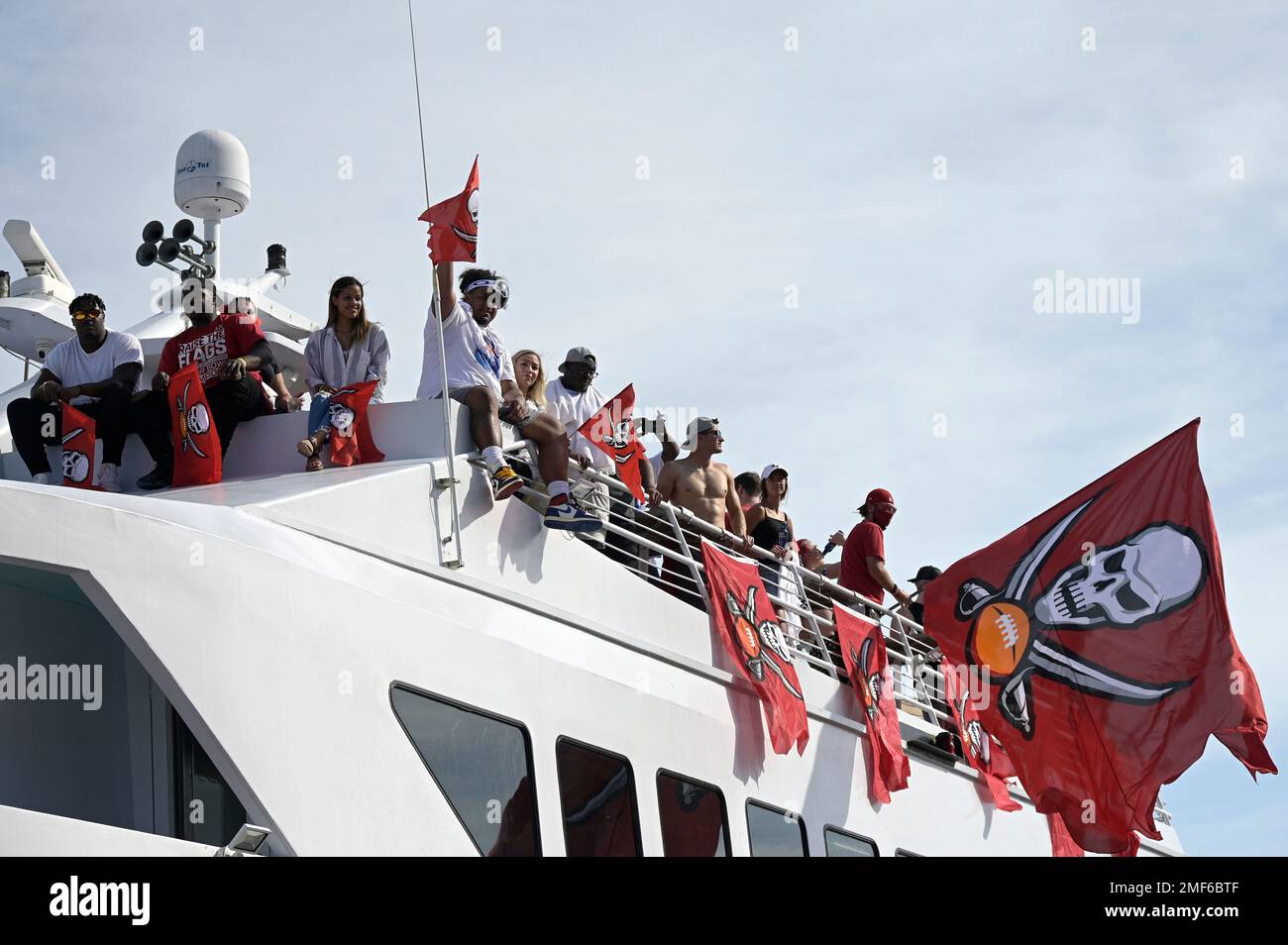 Tampa Bay Buccaneers players and family members wave to fans during a ...