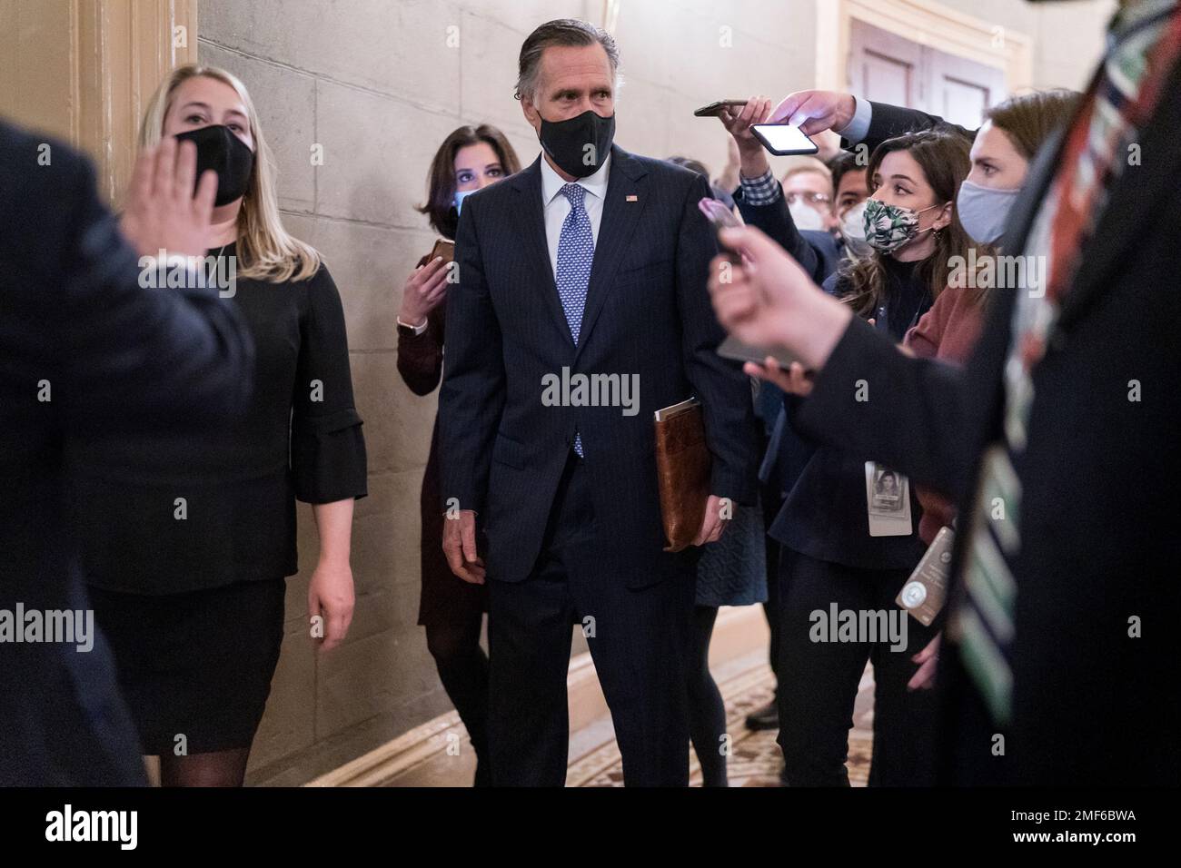 Reporters vie for a response from Sen. Mitt Romney, R-Utah, as Senators ...