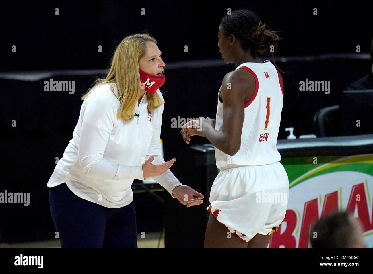 Maryland head coach Brenda Frese, left, talks with guard Diamond Miller ...