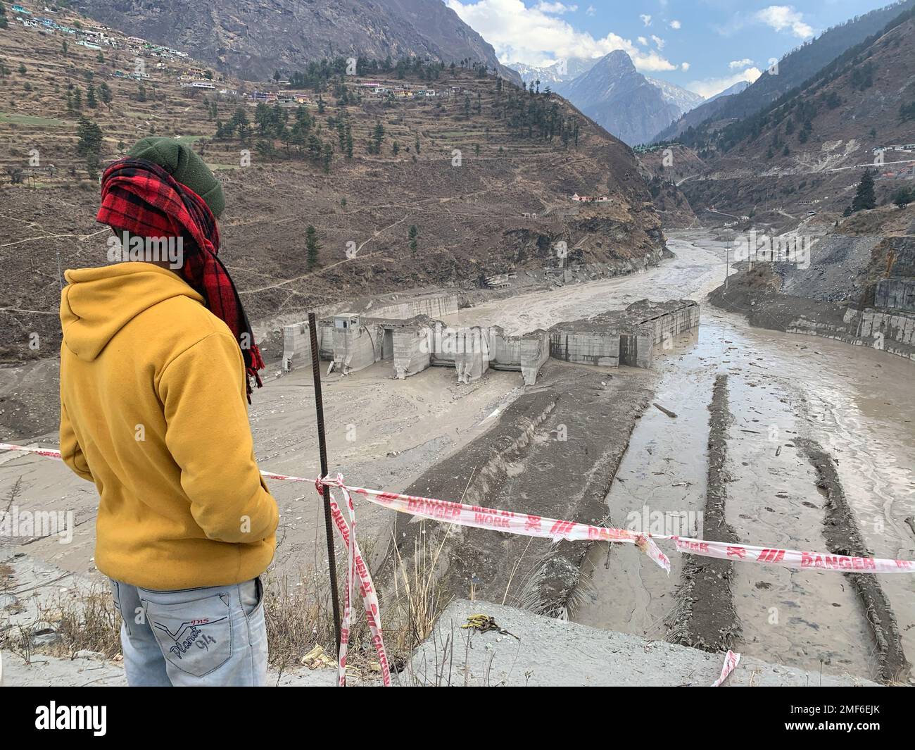 A relative of a missing person looks at the remains of Tapovan Hydro ...