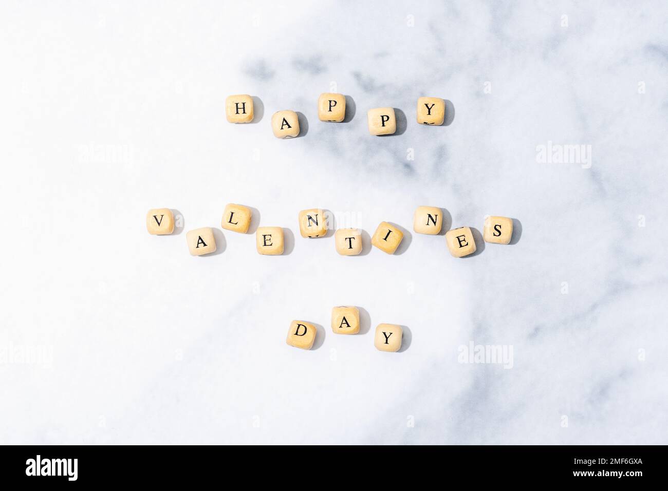 Wooden blocks with words Valentine's Day. Wooden letter blocks on ...