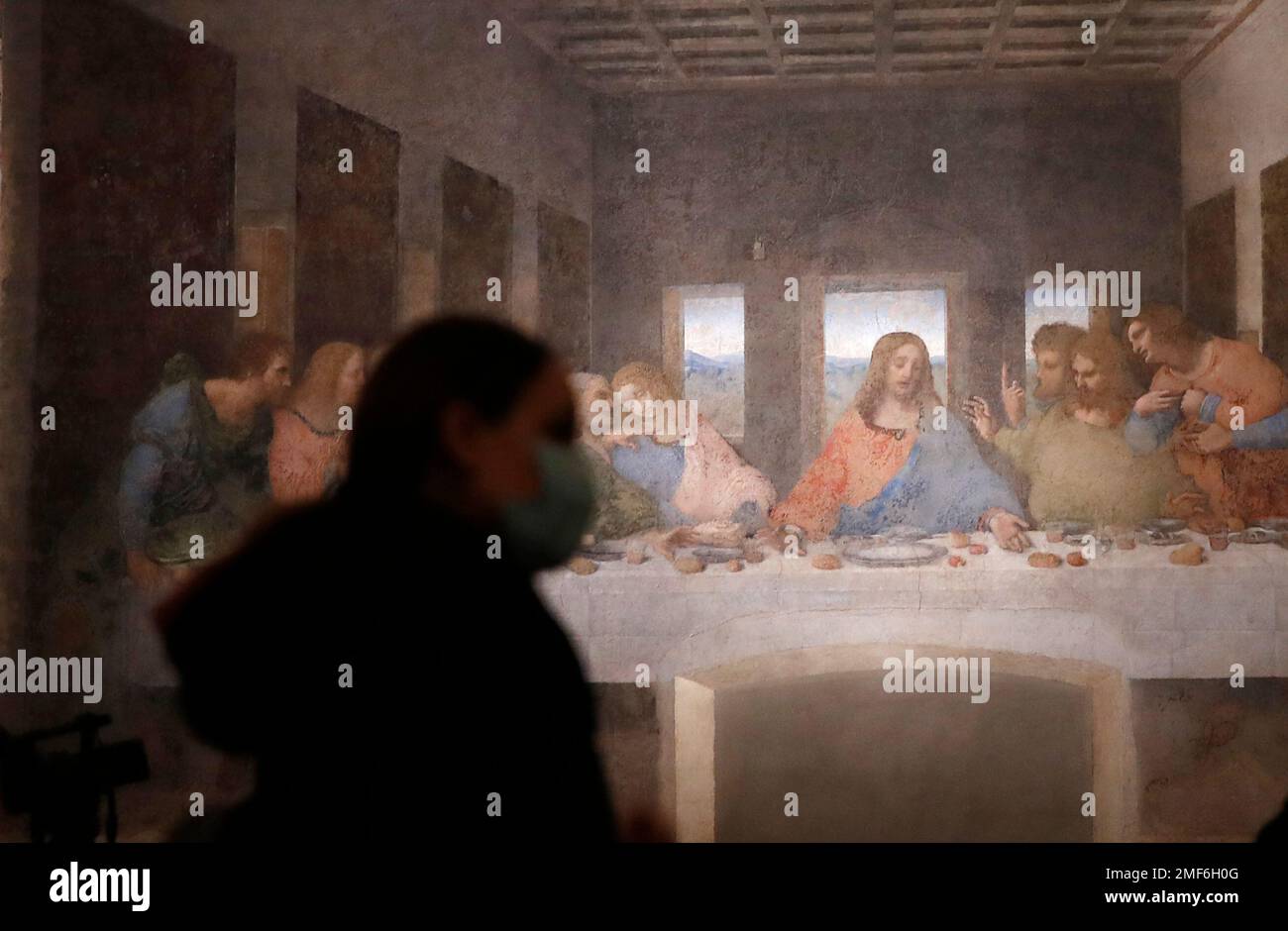 A woman admires Leonardo da Vinci's painting "Last Supper," dating to ...