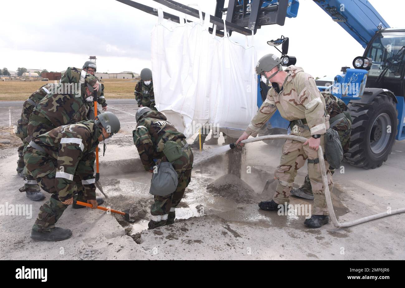 U.S. Air Force Airmen from the 100th Civil Engineer Squadron mix fast ...