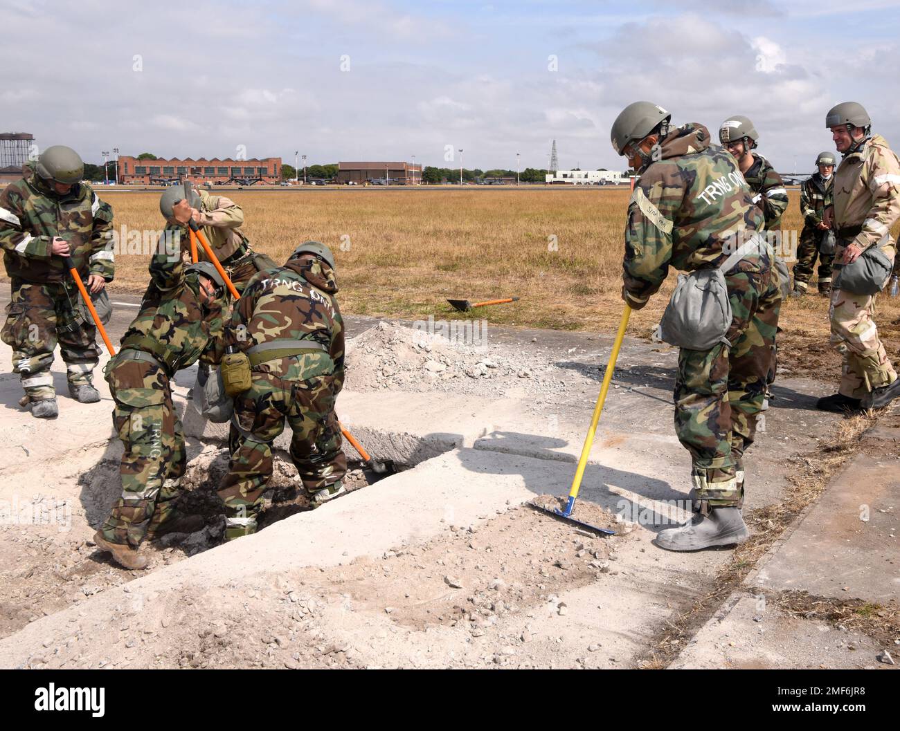U.S. Air Force Airmen from the 100th Civil Engineer Squadron clear ...
