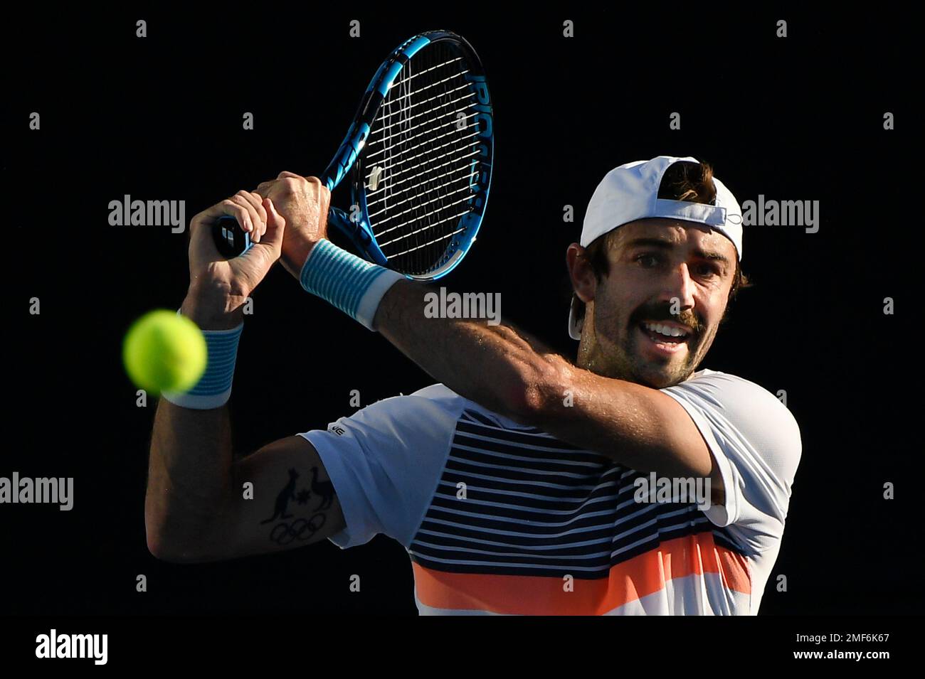 Australia's Jordan Thompson makes a forehand return to Norway's Casper ...