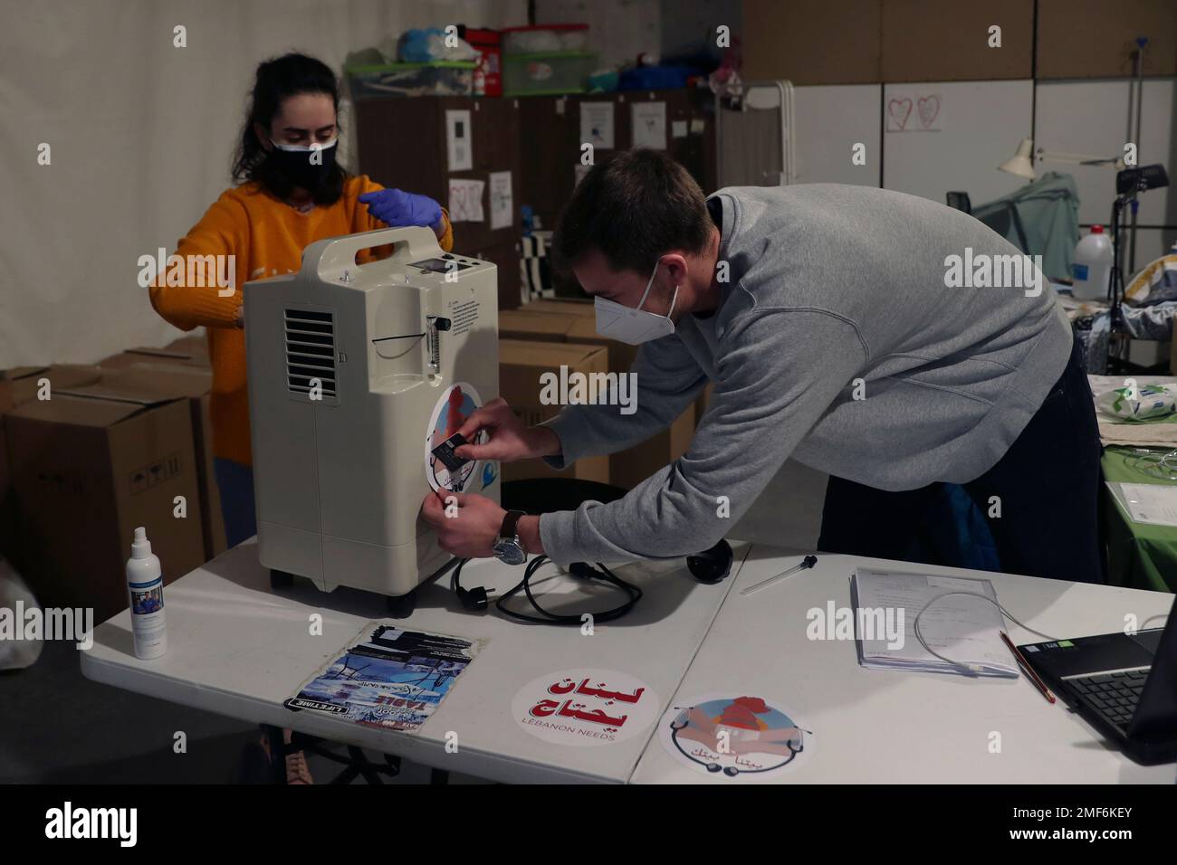 Members of Lebanese NGO Baytna Baytak Jad Farhat, right, and Gaelle ...