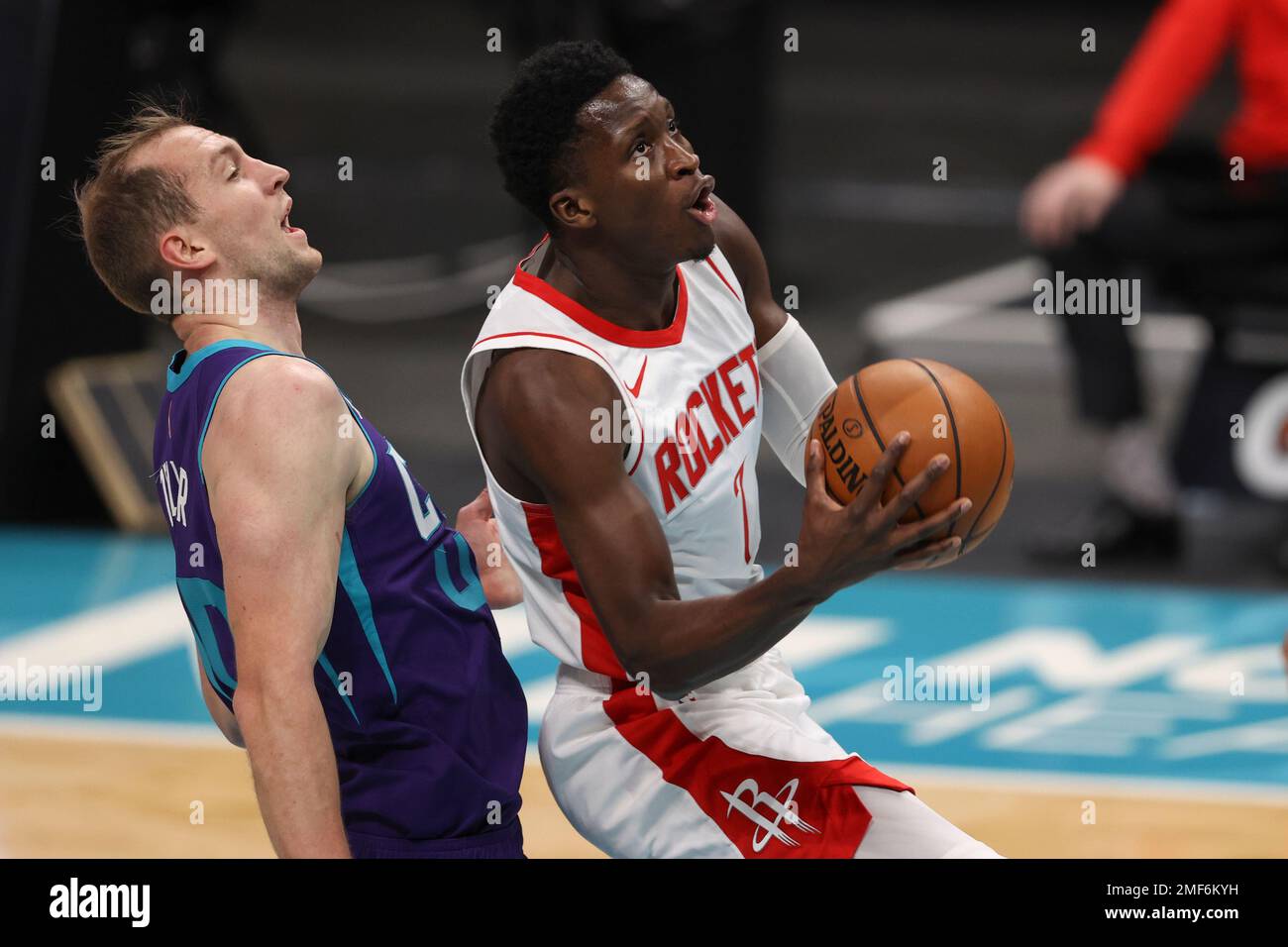 Houston Rockets guard Victor Oladipo, right, drives to the basket past ... Houston Rockets guard Victor Oladipo, right, drives to the basket past ...