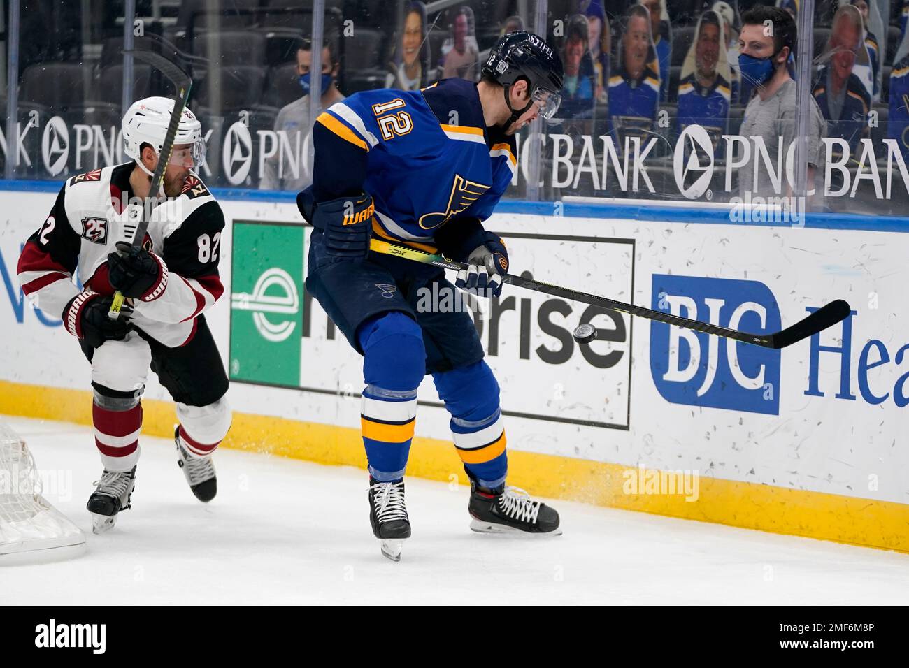 St. Louis Blues' Zach Sanford (12) and Arizona Coyotes' Jordan Oesterle ...