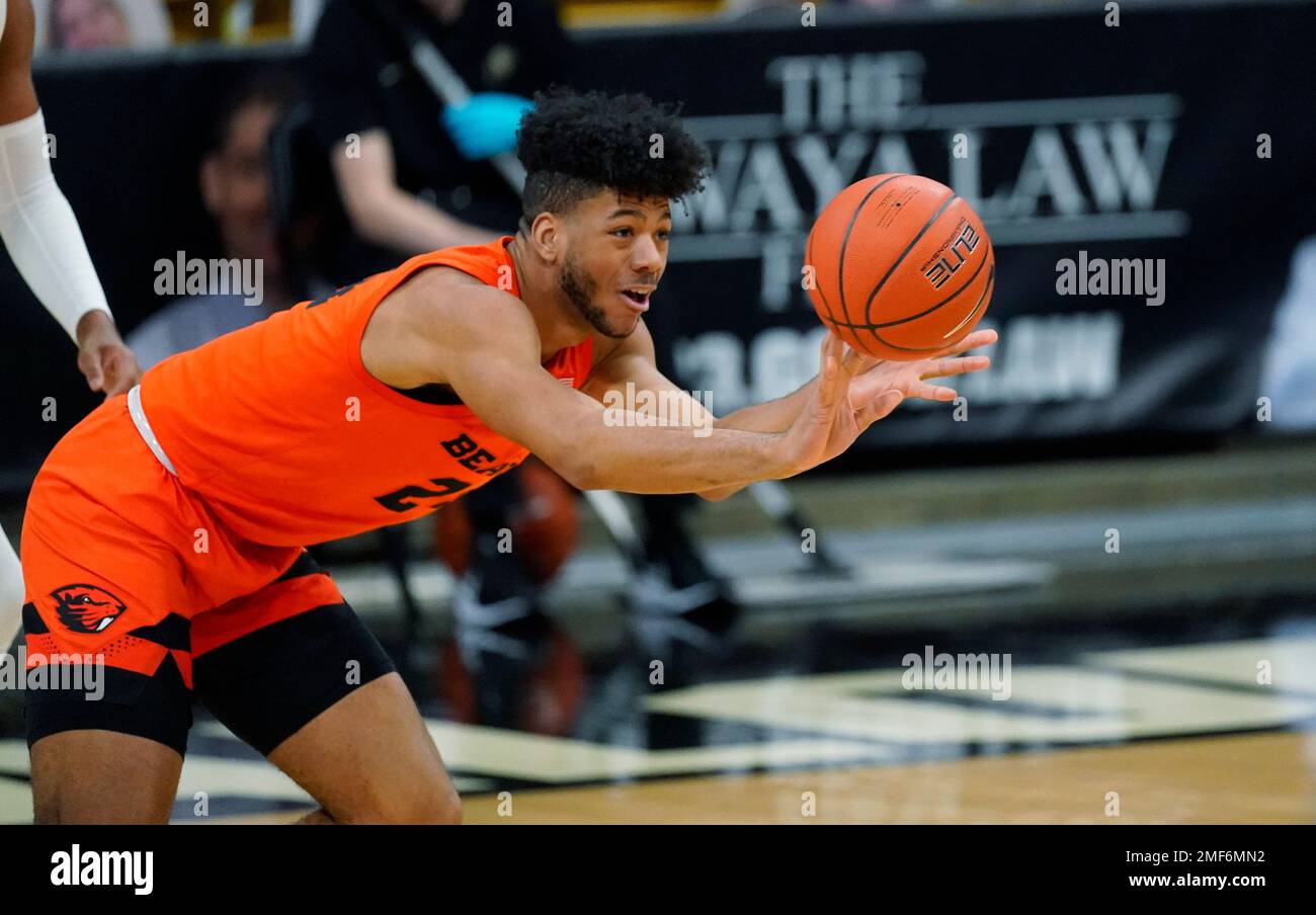 Oregon State forward Isaiah Johnson passes the ball to a teammate in ...