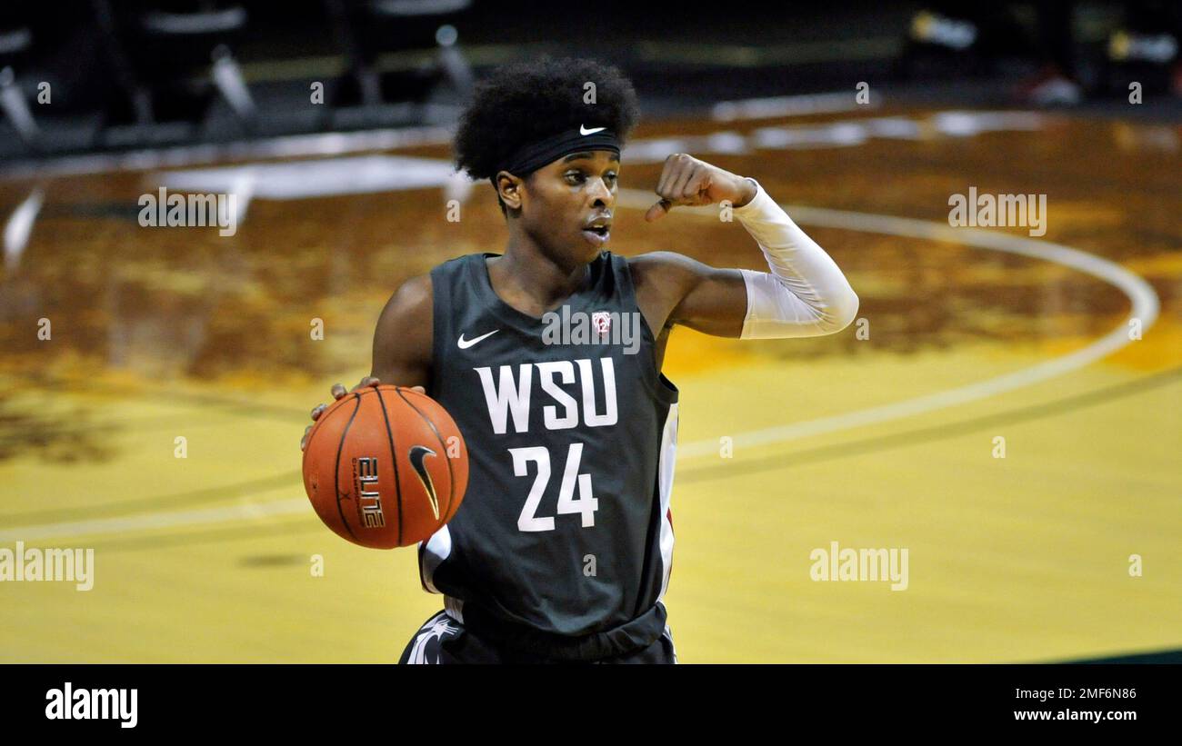 Washington State guard Noah Williams (24) brings the ball up the floor ...